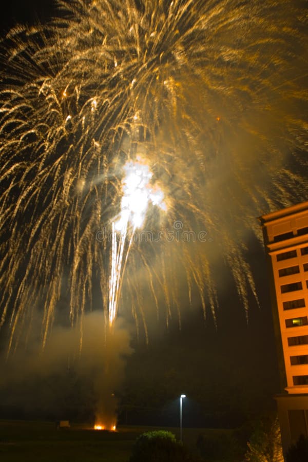 View of Fireworks Next To a Tall Building Stock Image - Image of tall ...