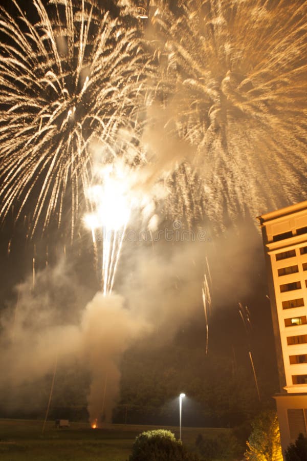 View of Fireworks Next To a Tall Building Stock Image - Image of ...