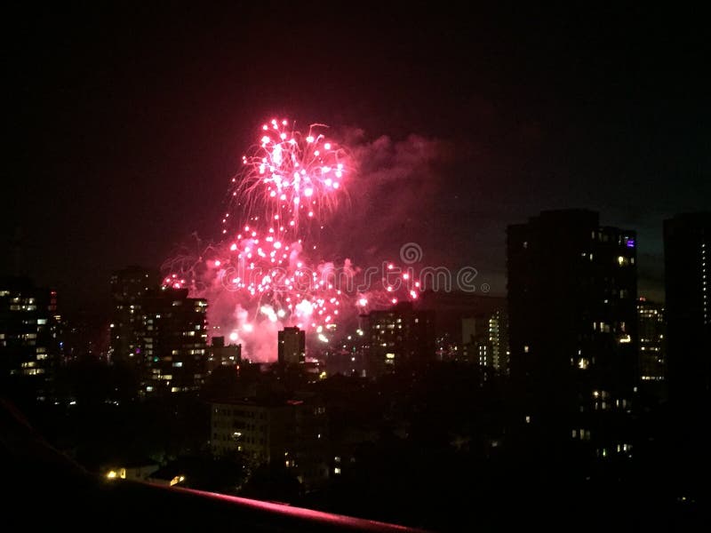 Fireworks at Night Over Buildings Stock Photo - Image of explode ...