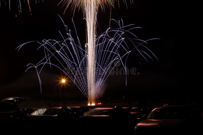Fireworks Over Cars stock photo. Image of flash, cars - 79596416