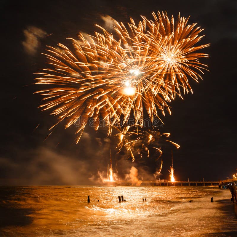 Fireworks over the sea stock photo. Image of evening - 77607952