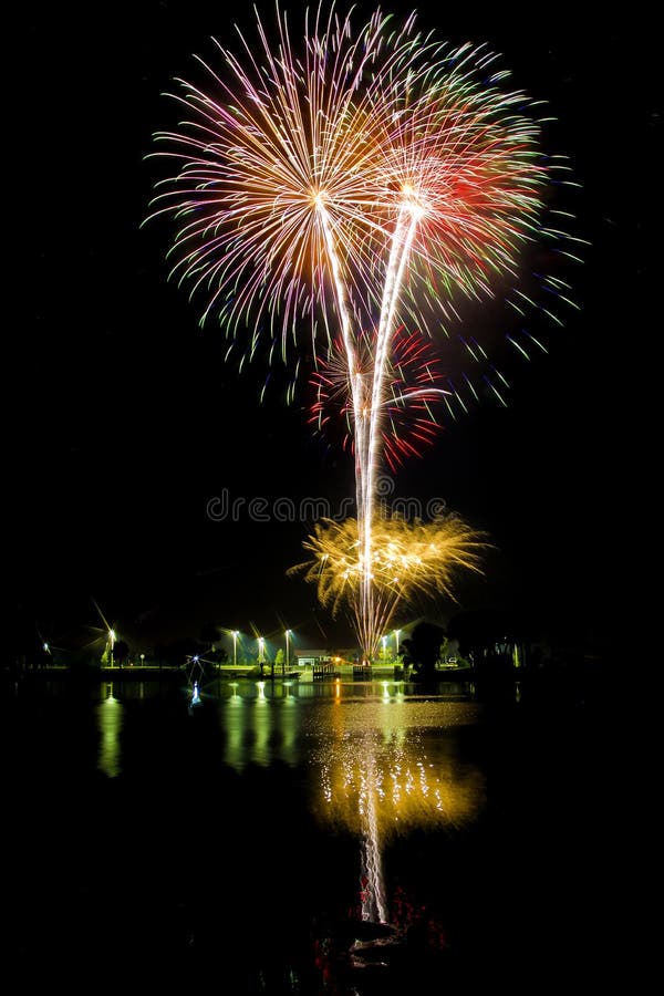 Fireworks over the water stock image. Image of festive - 25570145