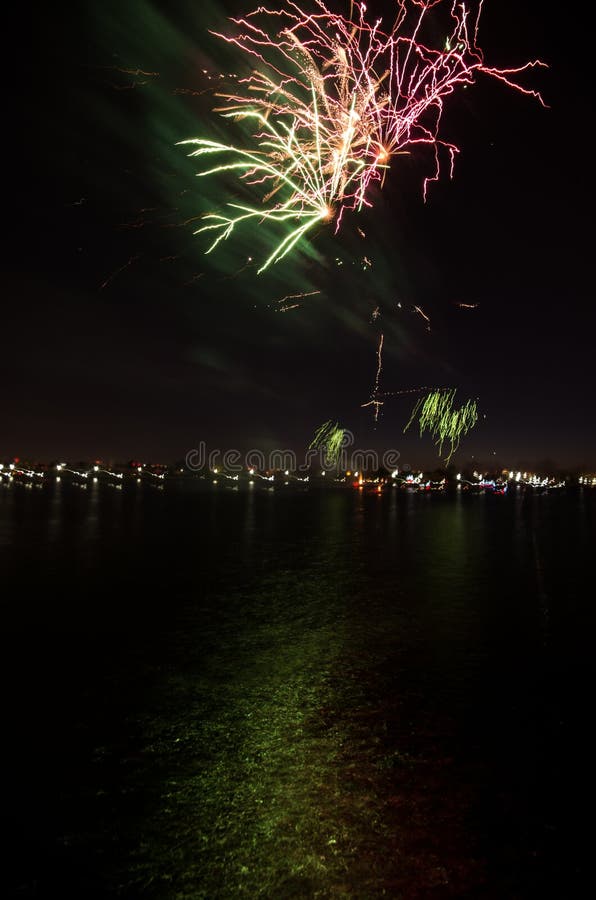 Fireworks over water stock photo. Image of boom, washington - 83274536