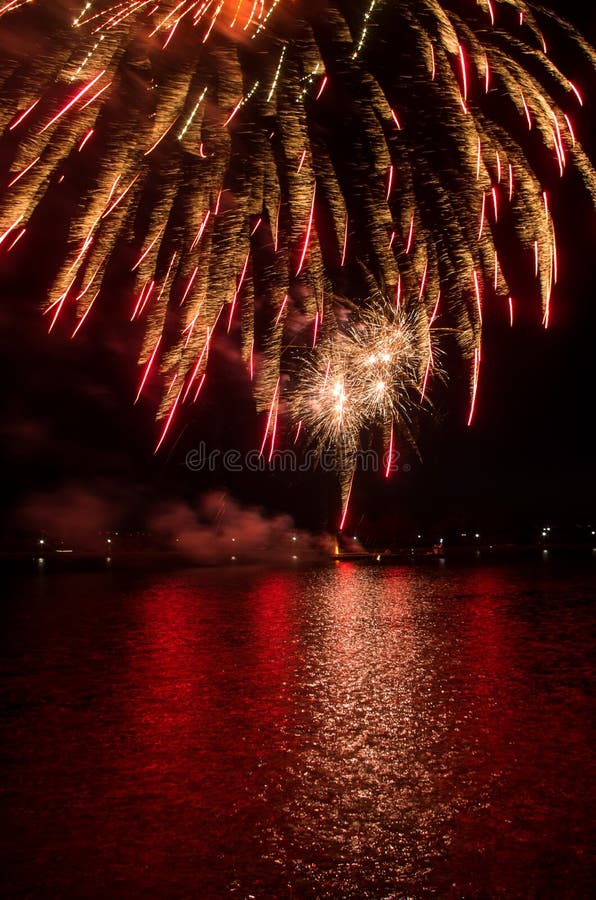 Fireworks over water stock image. Image of pyrotechnics - 83274765