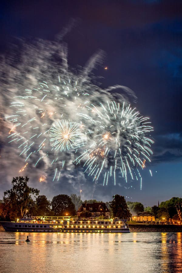 Fireworks on a River with a Boat Stock Photo - Image of night ...