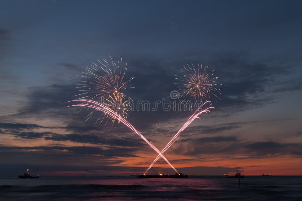 Fireworks at sunset stock photo. Image of pyrotechnic - 26391826