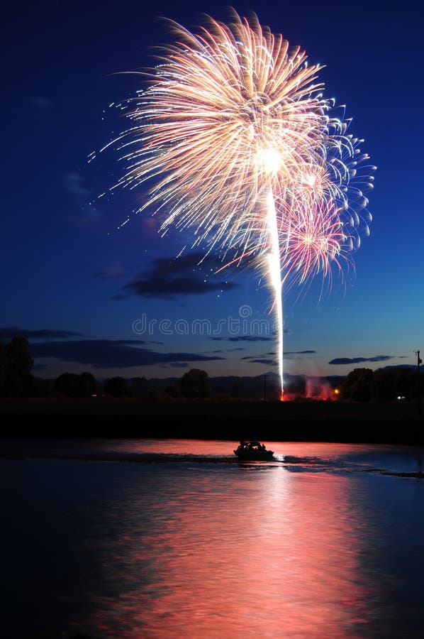 Firework over the lake. stock photo. Image of long, fire - 61882552