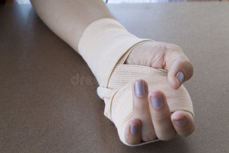 First Aid Accident Wrist with Liniment Stock Photo - Image of paramedic ...