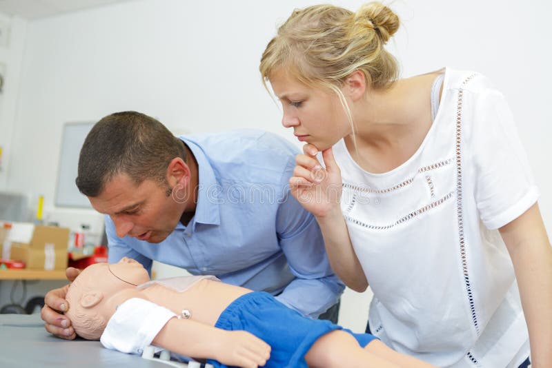 First Aid Course on Baby Dummy Stock Photo - Image of doll, class ...
