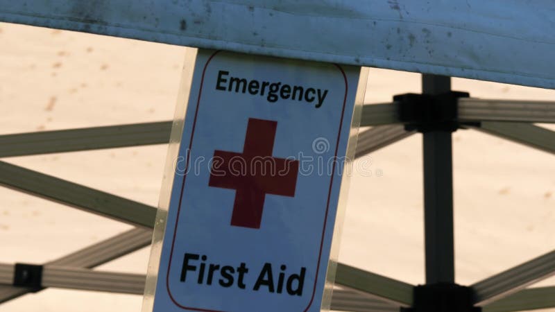 First Aid Emergency Help Flag in Event Tent Stock Video - Video of ...