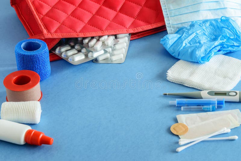 First Aid Kit on the Blue Background, Flat Lay. First Aid Medicine ...