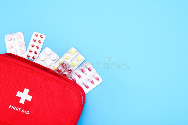 First Aid Kit with Pills on Table Indoors Stock Image - Image of home ...