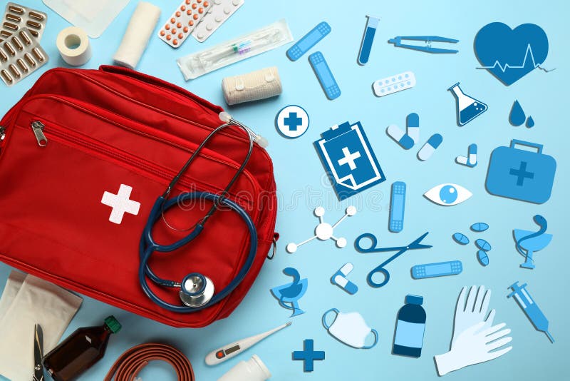 First Aid Kit on Light Grey Table Against White Background Stock Image ...