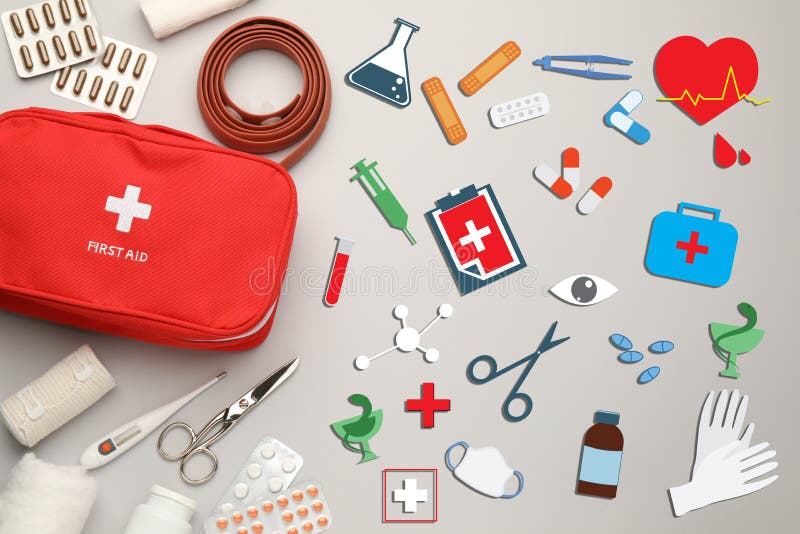 First Aid Kit on Light Grey Table Against White Background Stock Image ...