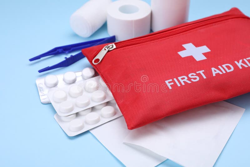 First Aid Kit on Light Blue Background, Closeup Stock Photo - Image of ...