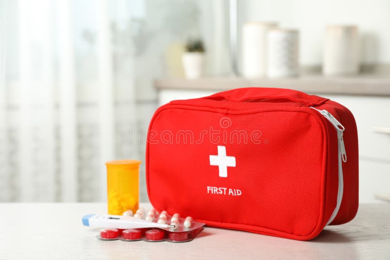 First Aid Kit with Pills on Table Indoors Stock Image - Image of home ...