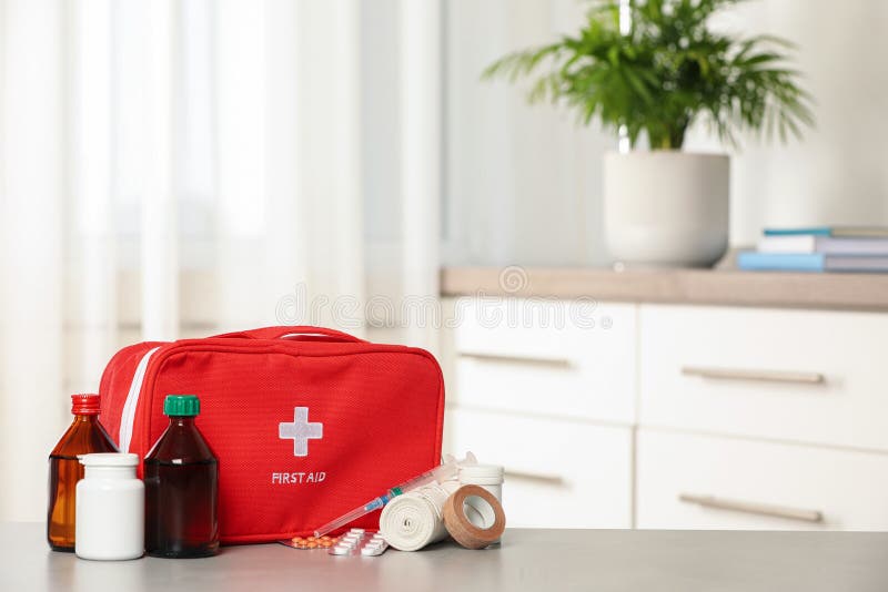 First Aid Kit on Table Indoors, Space for Text Stock Image - Image of ...