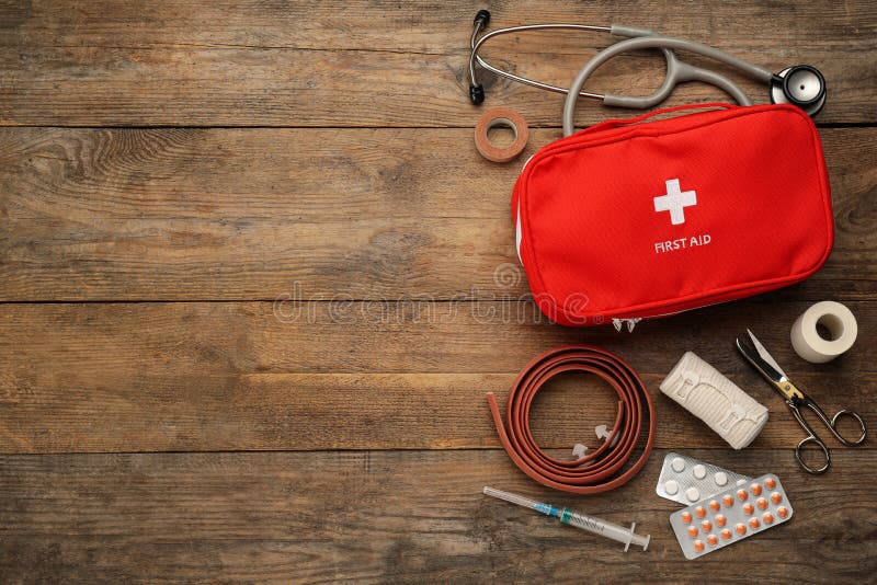 First Aid Kit on Wooden Table, Flat Lay. Space for Text Stock Image ...