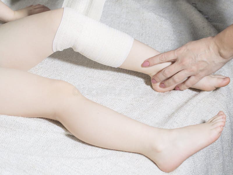 First aid at knee trauma. stock photo. Image of broken - 107722214