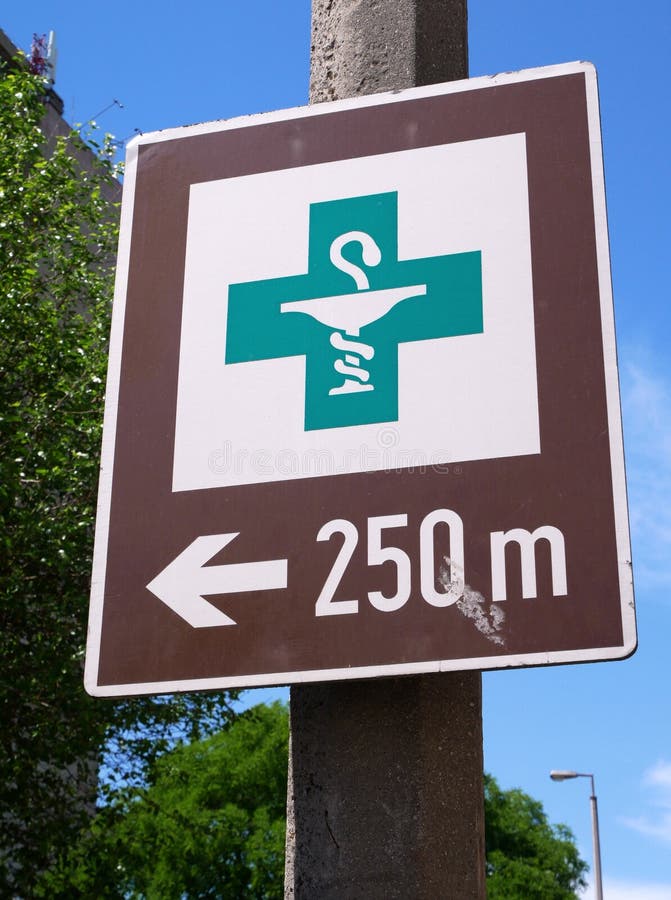 First Aid and Pharmacy Sign on a Pole Stock Photo - Image of distance ...