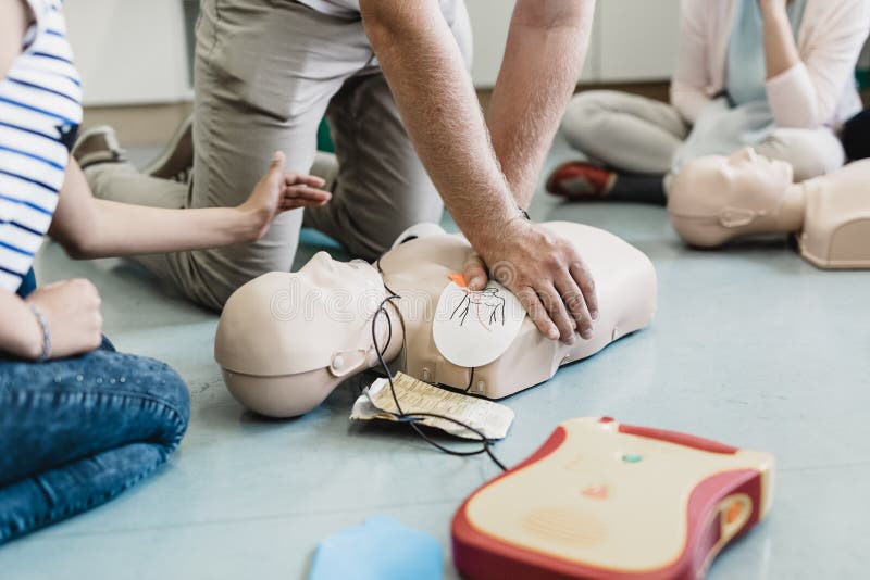 First Aid Resuscitation Course Using AED. Stock Photo - Image of ...