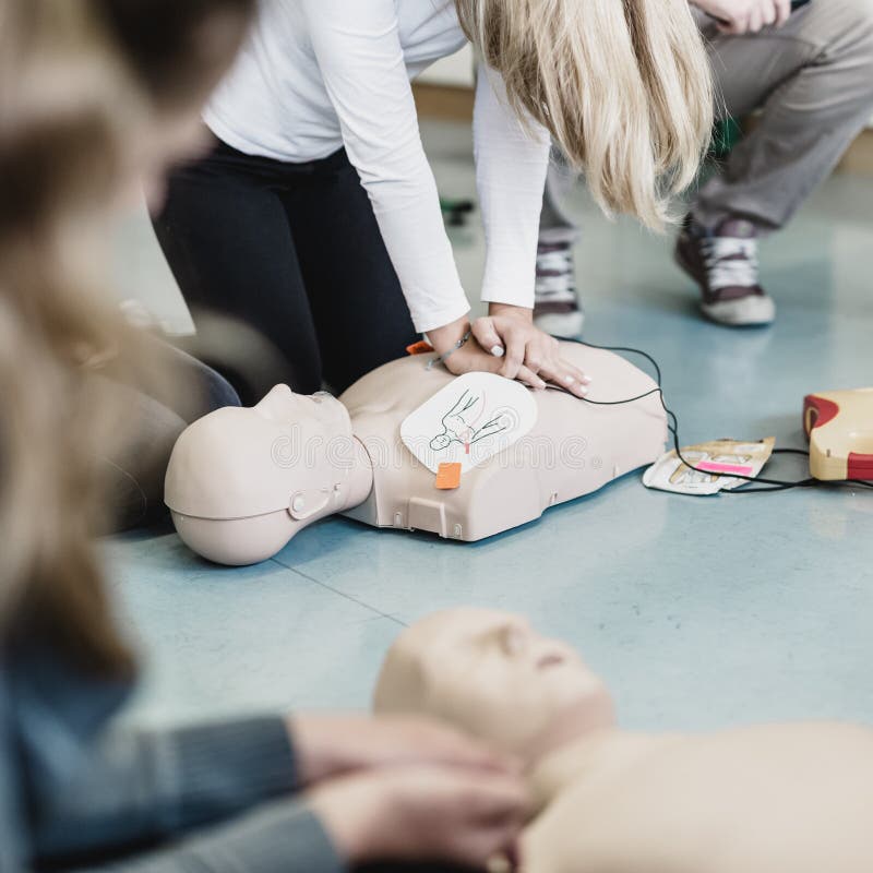 First Aid Resuscitation Course Using AED. Stock Photo - Image of ...