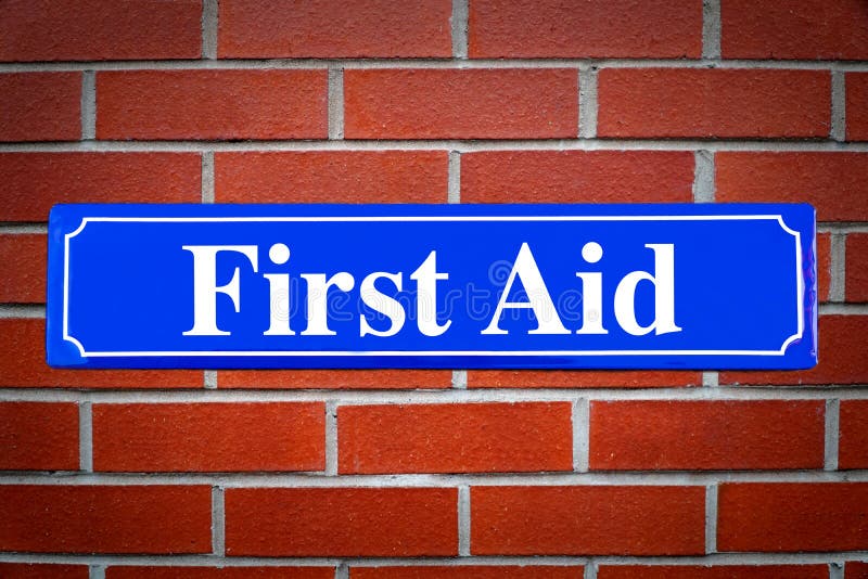 First Aid Street Sign on Brick Wall Stock Photo - Image of saver ...