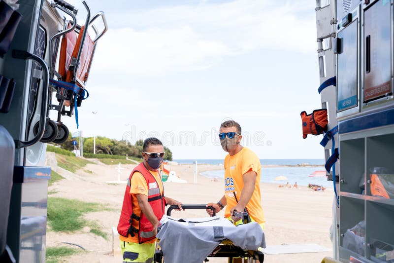 First Aid Team Working on the Beach Stock Image - Image of medicine ...