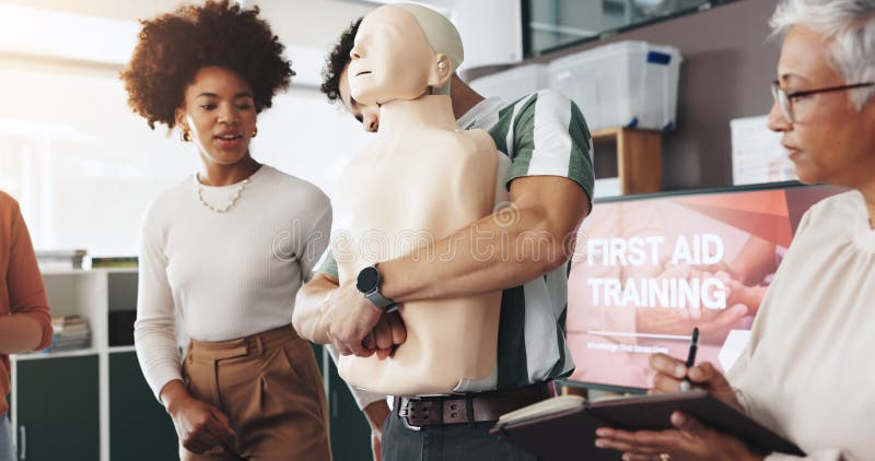 First Aid, Training and People with Choking Dummy for CPR, Abdominal Thrusts and Life Saving ...