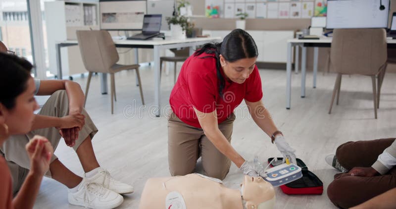 First Aid Training, People and Instructor with Demonstration for Medical Simulation and ...