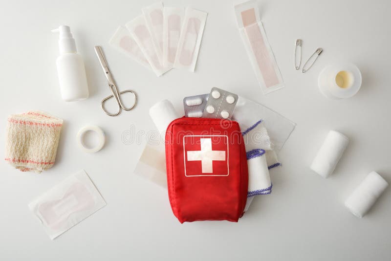 First Aid Travel Bag on White Table Full of Tools Stock Photo - Image ...