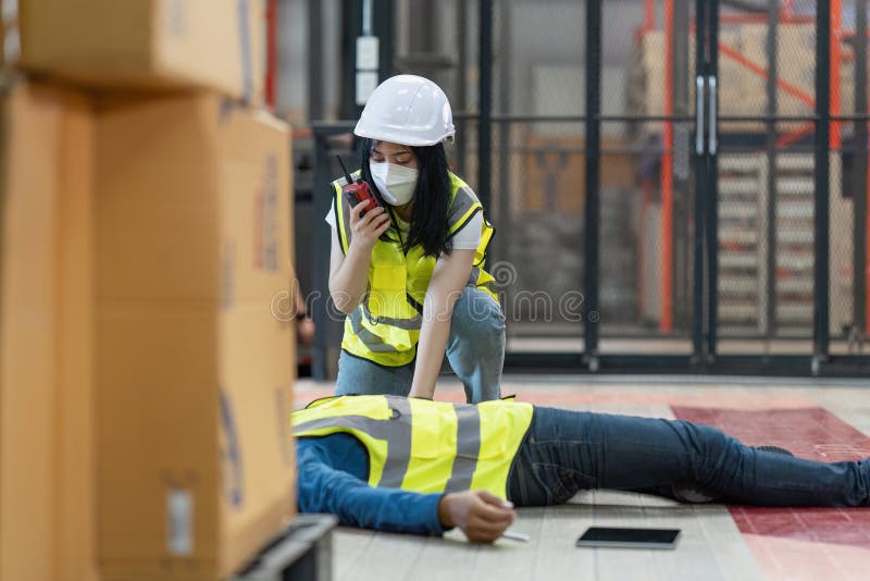 First Aid by Workmate. Working at Warehouse. Male Warehouse Worker Have ...