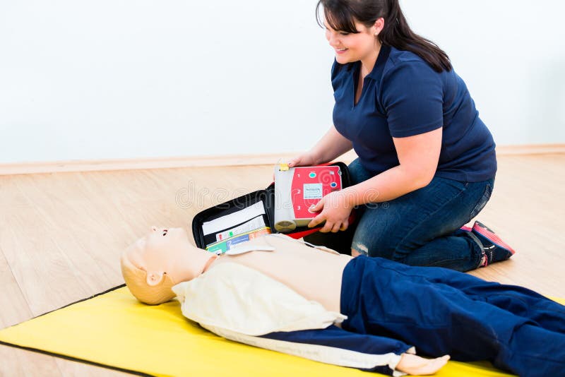 First Aider Trainee Learning Revival with Defibrillator Stock Photo ...