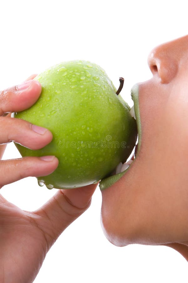 First bite of green apple stock photo. Image of healthy - 5580094