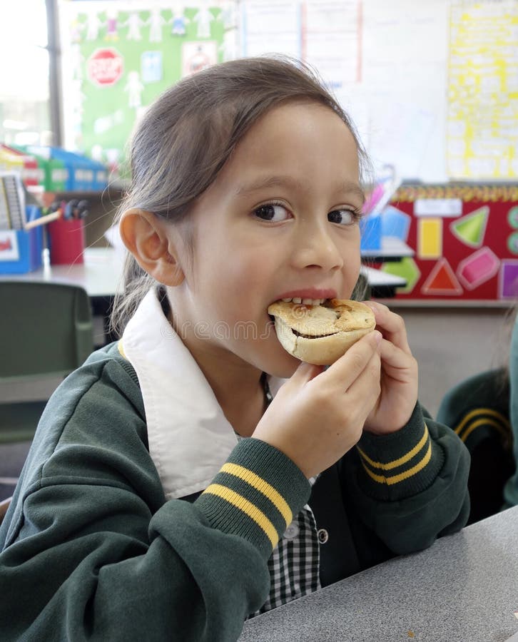 Young Girl Taking a Bite from Her Apple. Stock Image - Image of asian ...