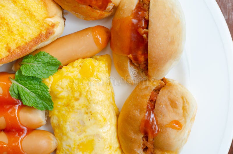 First Breakfast with Sausage, Bread,egg on White Plate in the Morning ...