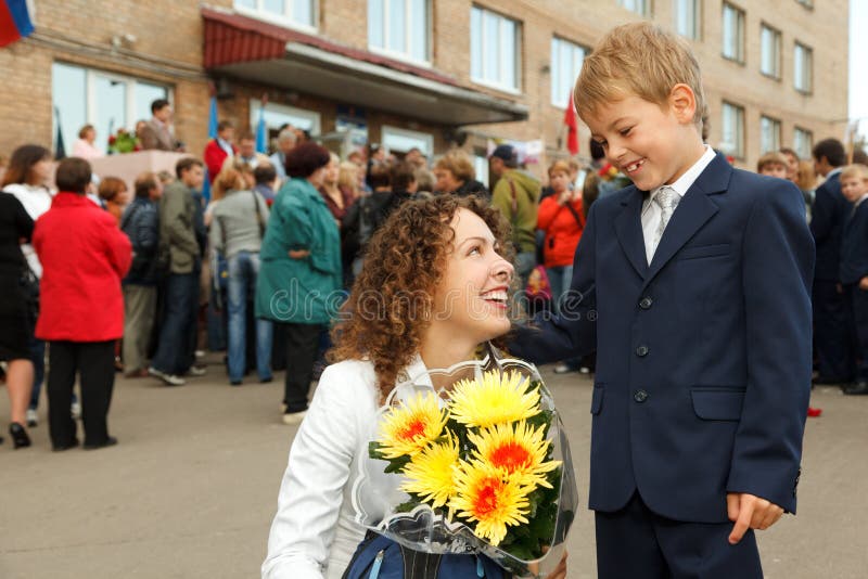 First Class, Boy and His Mother with Bouquet Stock Image - Image of ...