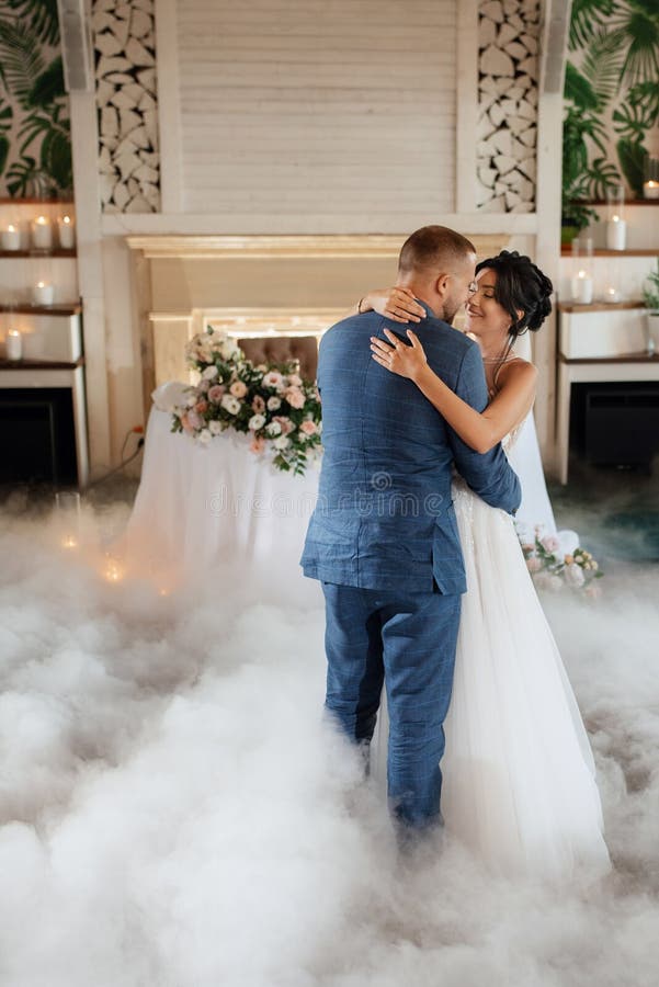 The First Dance of the Bride and Groom Inside a Restauran Stock Photo ...