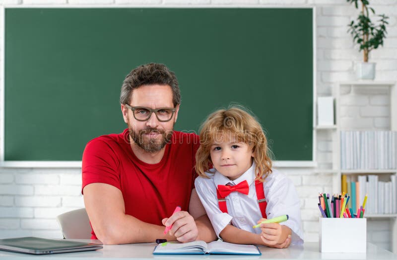 First Day at School. Cute Little Boy Studying Lesson in Class. Cute ...