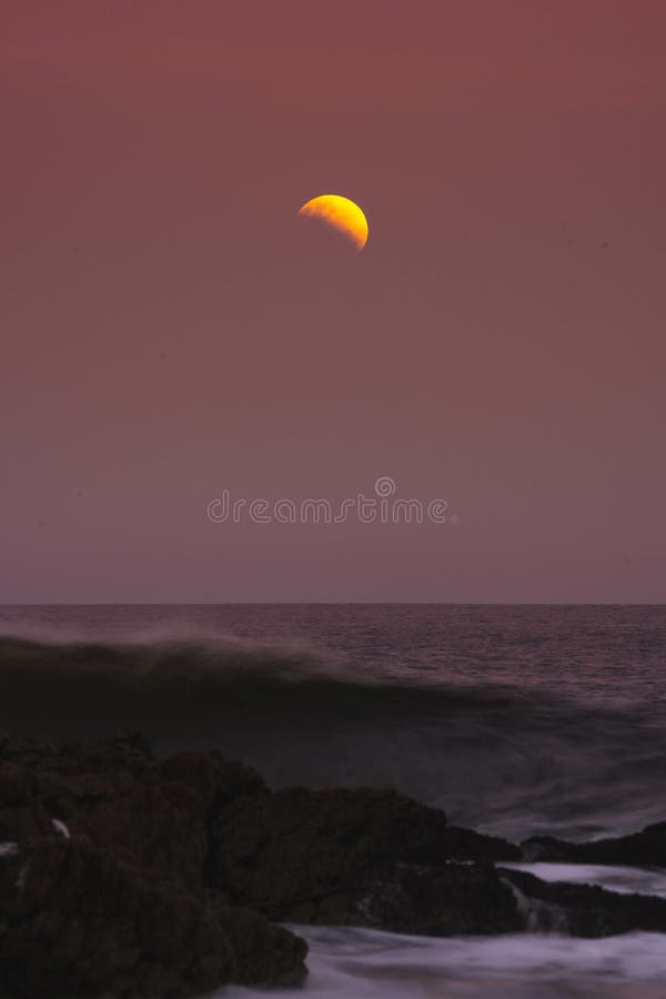 First Glare of the Moon Over the Splashing Sea Water at Sunset Stock ...