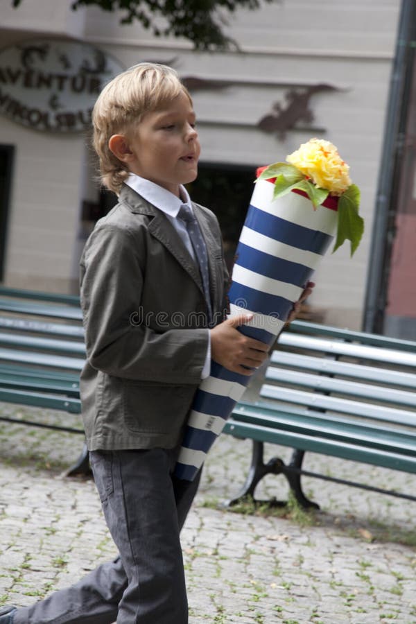 A First-grader Girl in a Beautiful Elegant Modern School Uniform on the ...