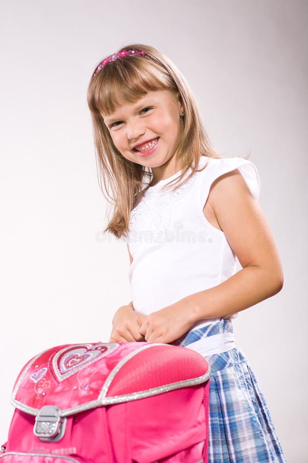 A First-grader Girl in a Beautiful Elegant Modern School Uniform on the ...