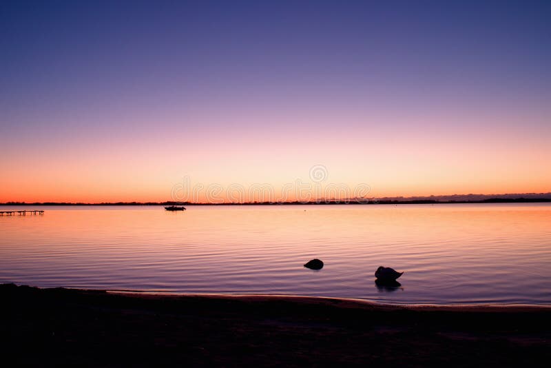 First Light of Day Creates Dramatic Colors in the Sky Over Ocean. Stock ...