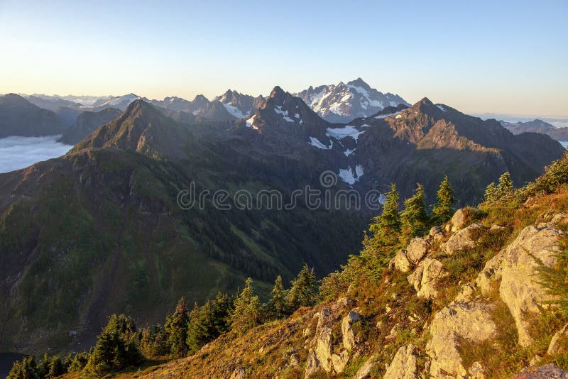 First Light Falls on the Cascade Mountains Stock Photo - Image of ...