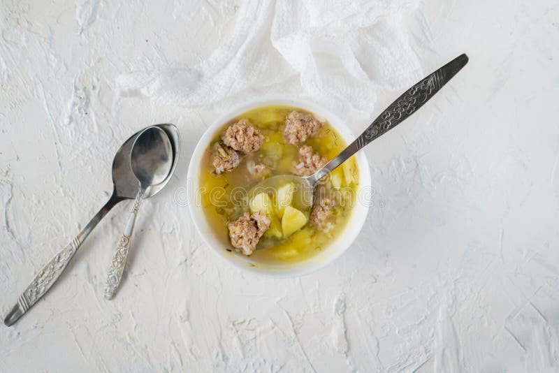 First Person View of a Person Eat Steaming Soup with Meatballs Using a ...