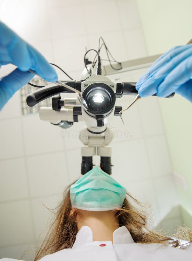 First Person View on Female Dentist Using Microscope Stock Image ...
