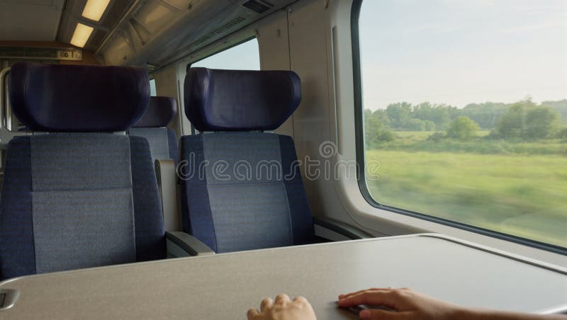 First-person View Inside a Passenger Train with Hands on Table, Empty ...