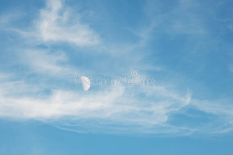 A First Quarter Moon Apparently Floats with the Clouds in this Daylight ...