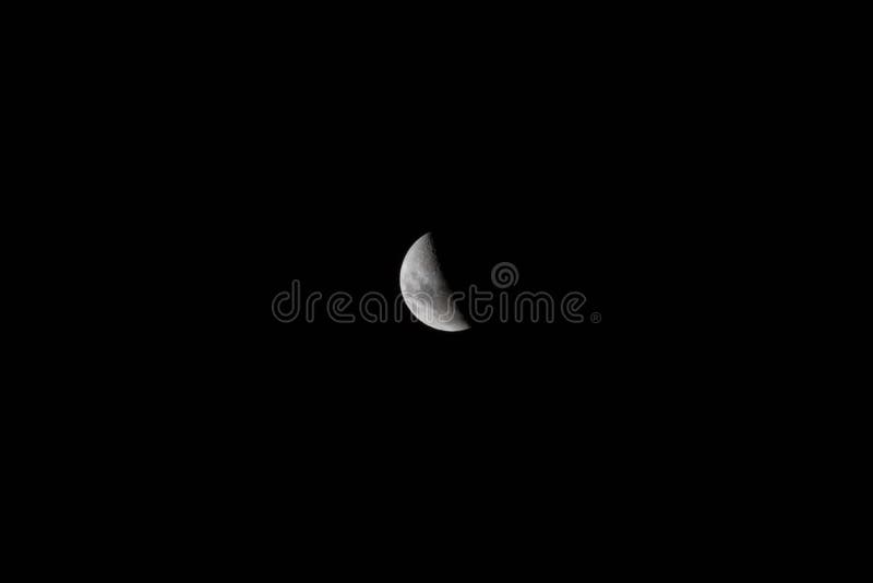 First Quarter Moon Isolated in the Night Sky. Stock Image - Image of ...