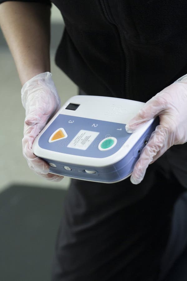 First Response Worker Demonstrates CPR and Proper Defibrillator ...